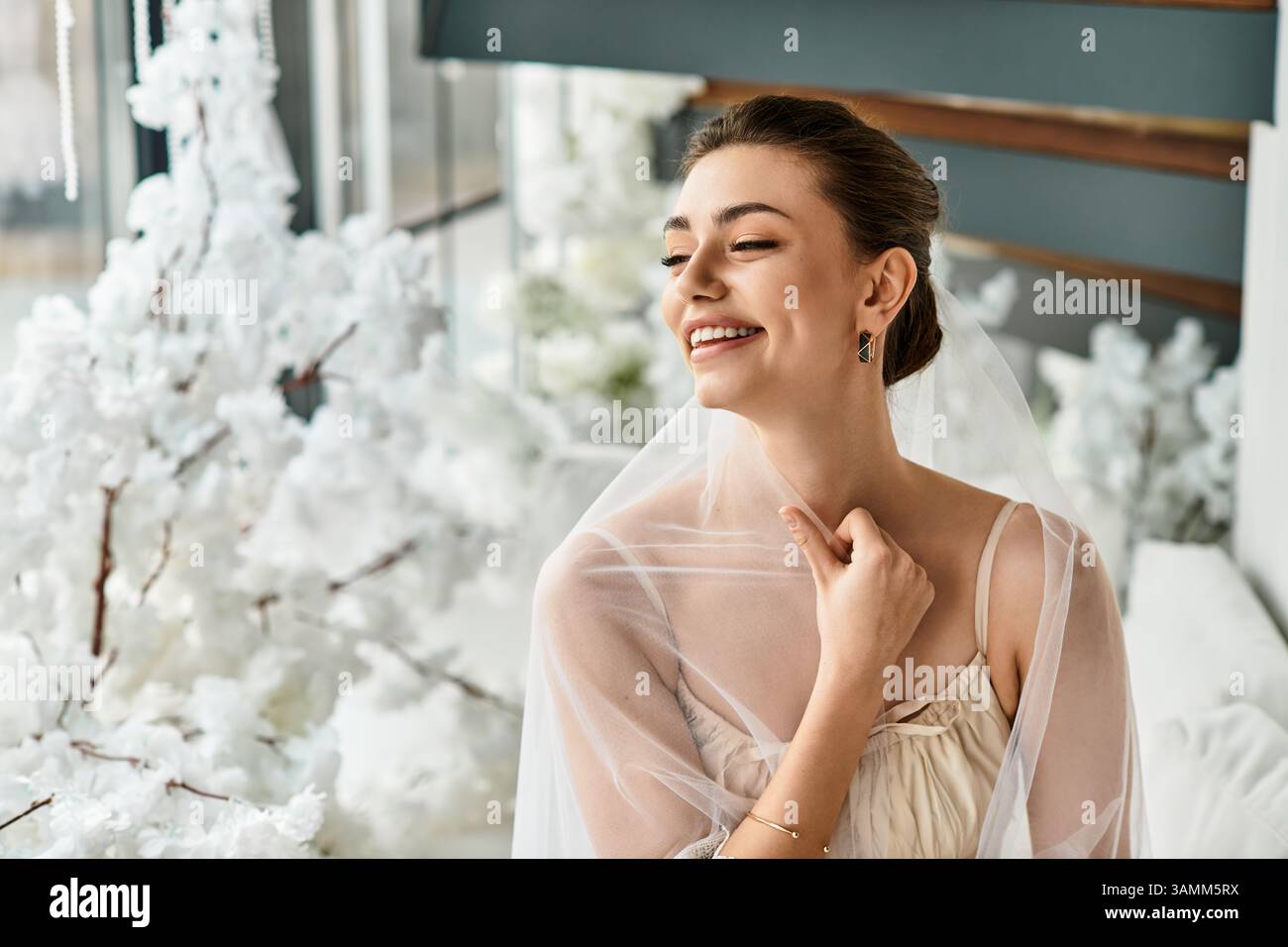 A radiant bride enjoys a moment of happiness surrounded by delicate ...