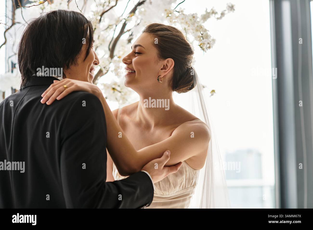 A loving couple shares a tender moment during their wedding ceremony ...