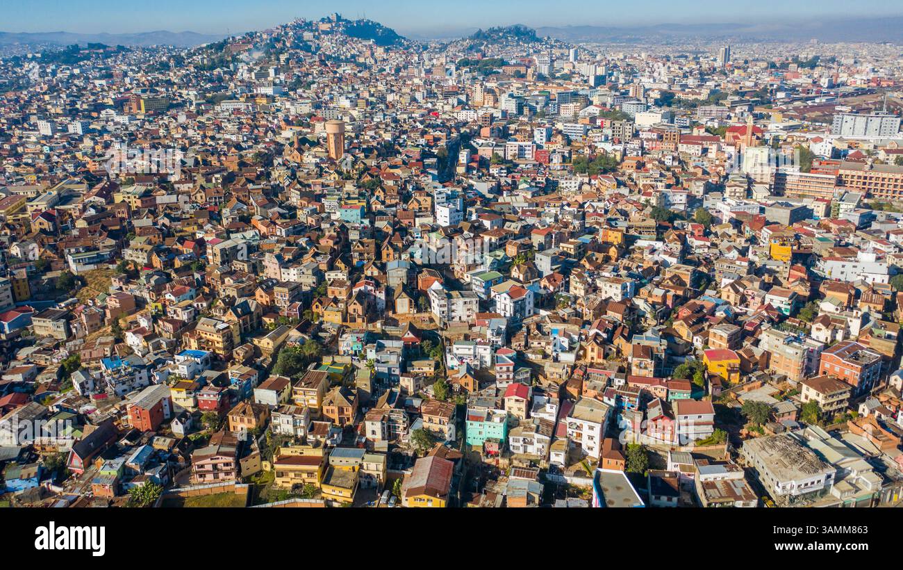 Aerial view of vibrant slums and dense rooftops in a bustling urban ...