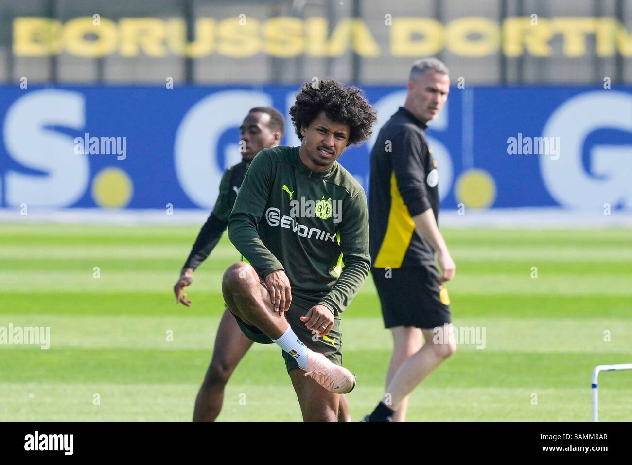 Dortmund's Karim Adeyemi exercises during a training session ahead of ...