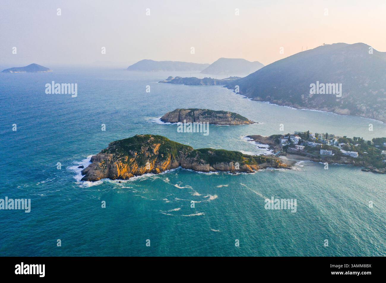 Aerial view of rocks, nature and ocean in Hong Kong at sunset, China ...