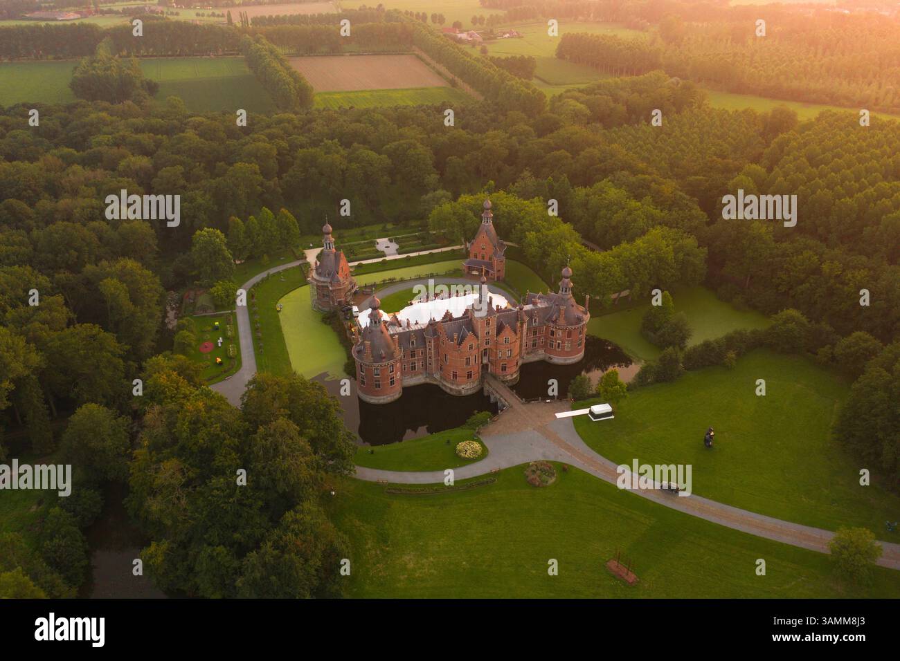 Aerial view of Ooidonk castle during sunset, situated near Gent ...