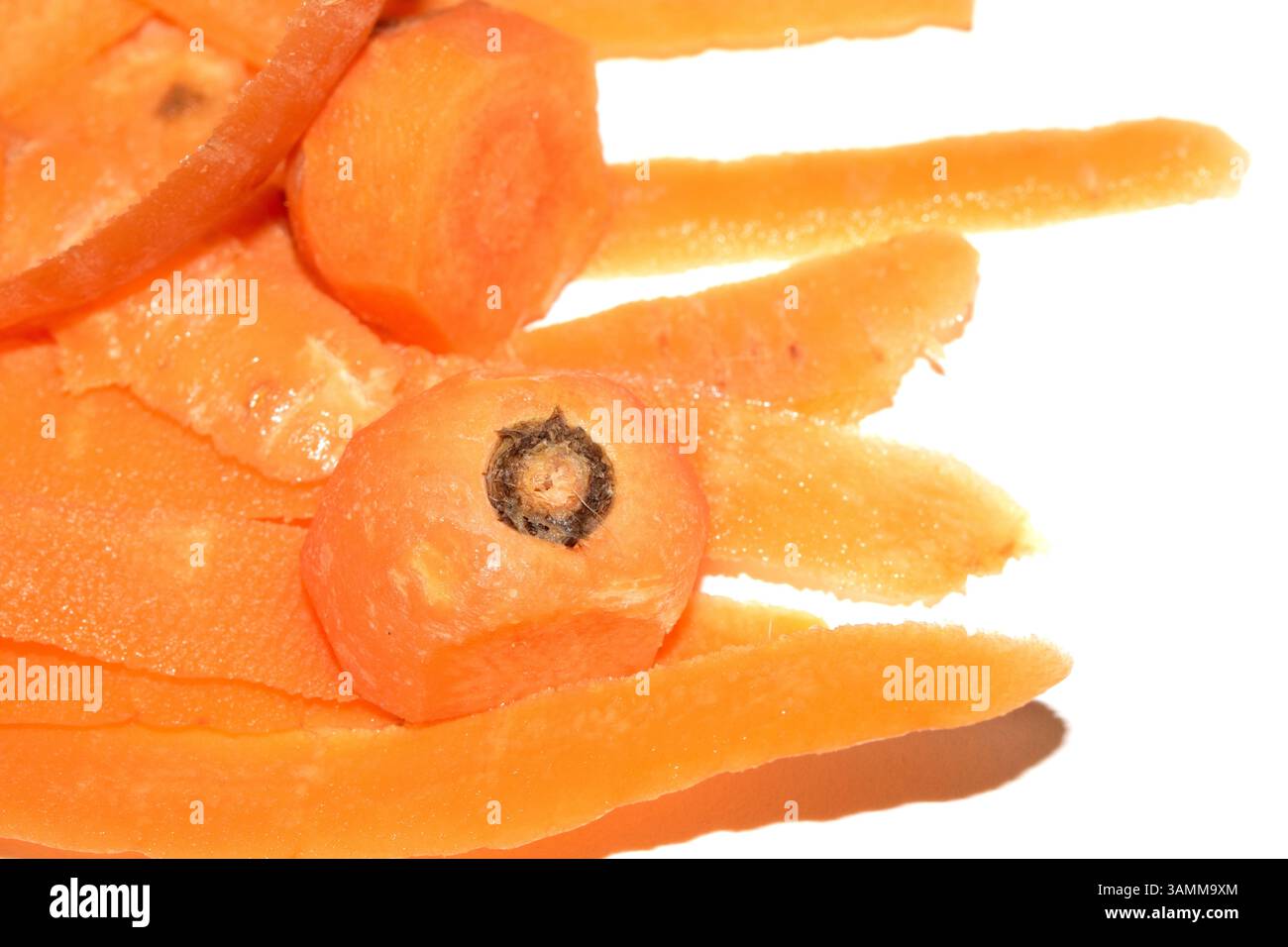 Close up of carrot scrap peelings food waste for compost on white ...