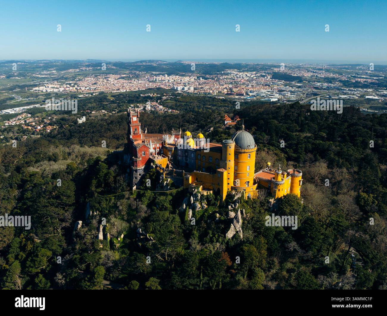 Aerial view of the beautiful National Palace of Pena surrounded by lush ...