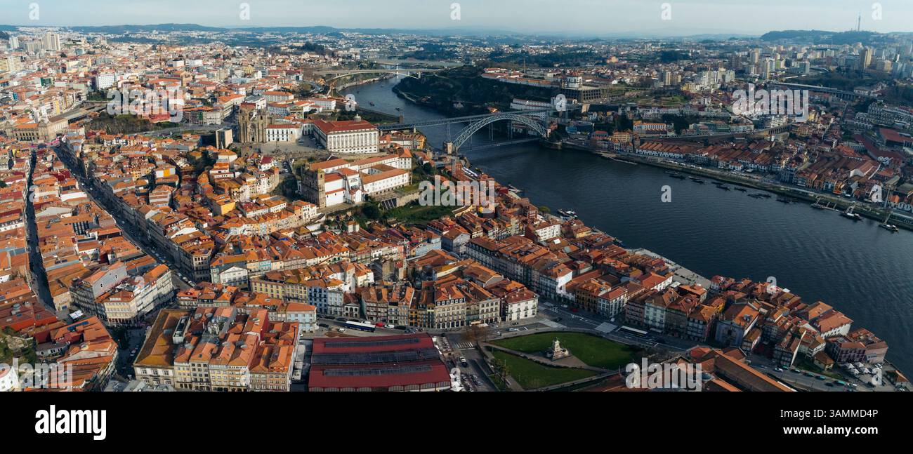 Aerial view of the Douro River and Dona Maria Pia Bridge with charming ...