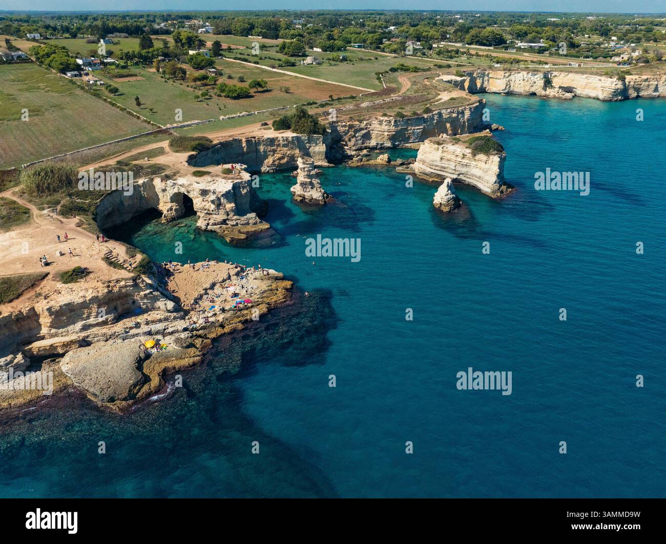 Aerial view of beach Torre Sant'Andrea with azure water, rocky ...