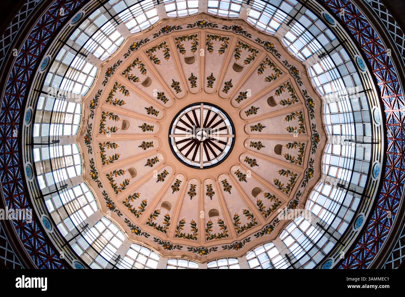 Interior dome ceiling with floral decoration and radial glass windows ...