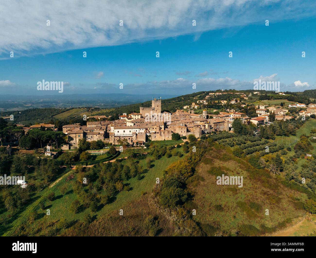 Aerial view of historic medieval old town surrounded by scenic hills ...