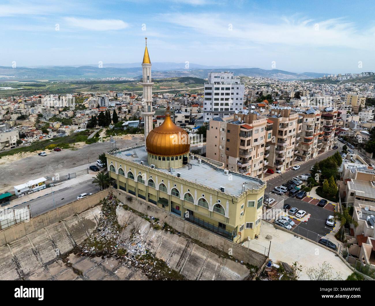 Aerial view of nazareth cityscape featuring the golden dome mosque and ...