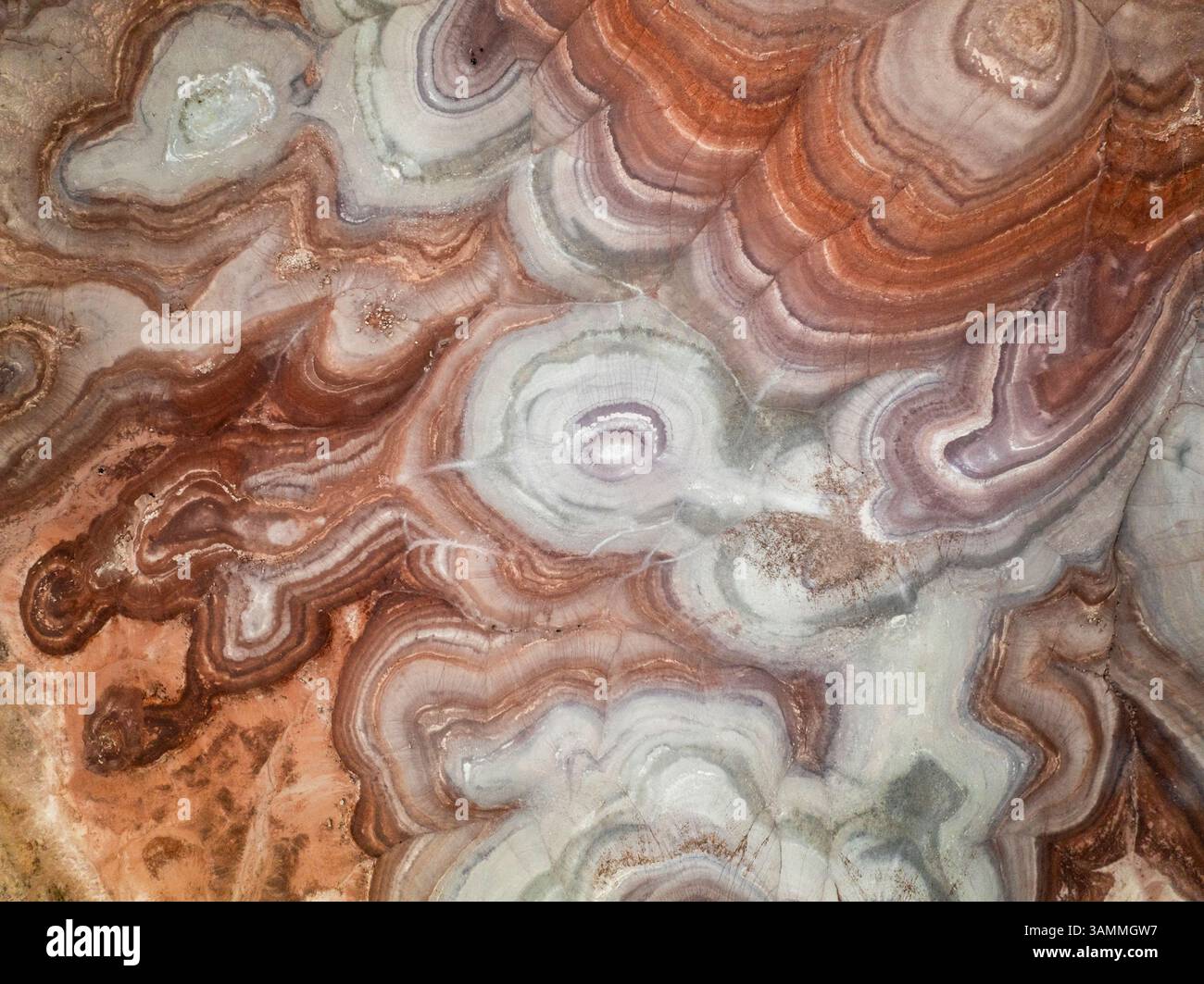 Aerial view of colorful and surreal rock formations with layers and ...