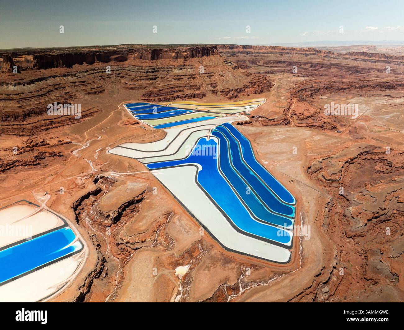 Aerial view of colorful potash ponds amidst majestic rock formations ...