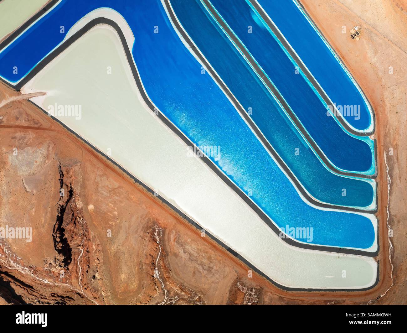 Aerial view of colorful saline ponds with geometric patterns in a ...
