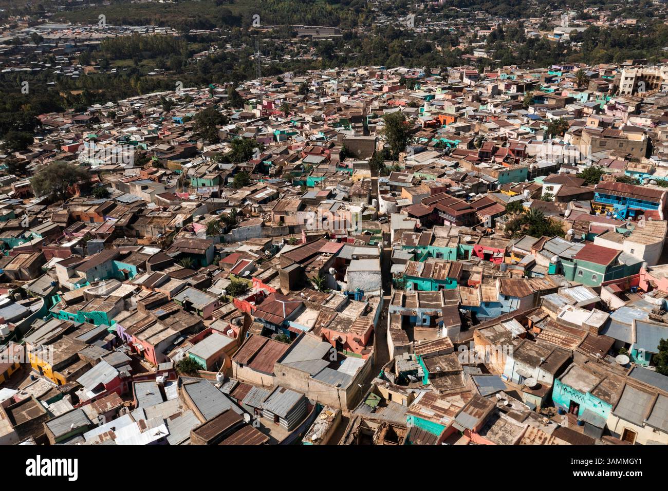 Aerial view of densely populated urban landscape with colorful rooftops ...
