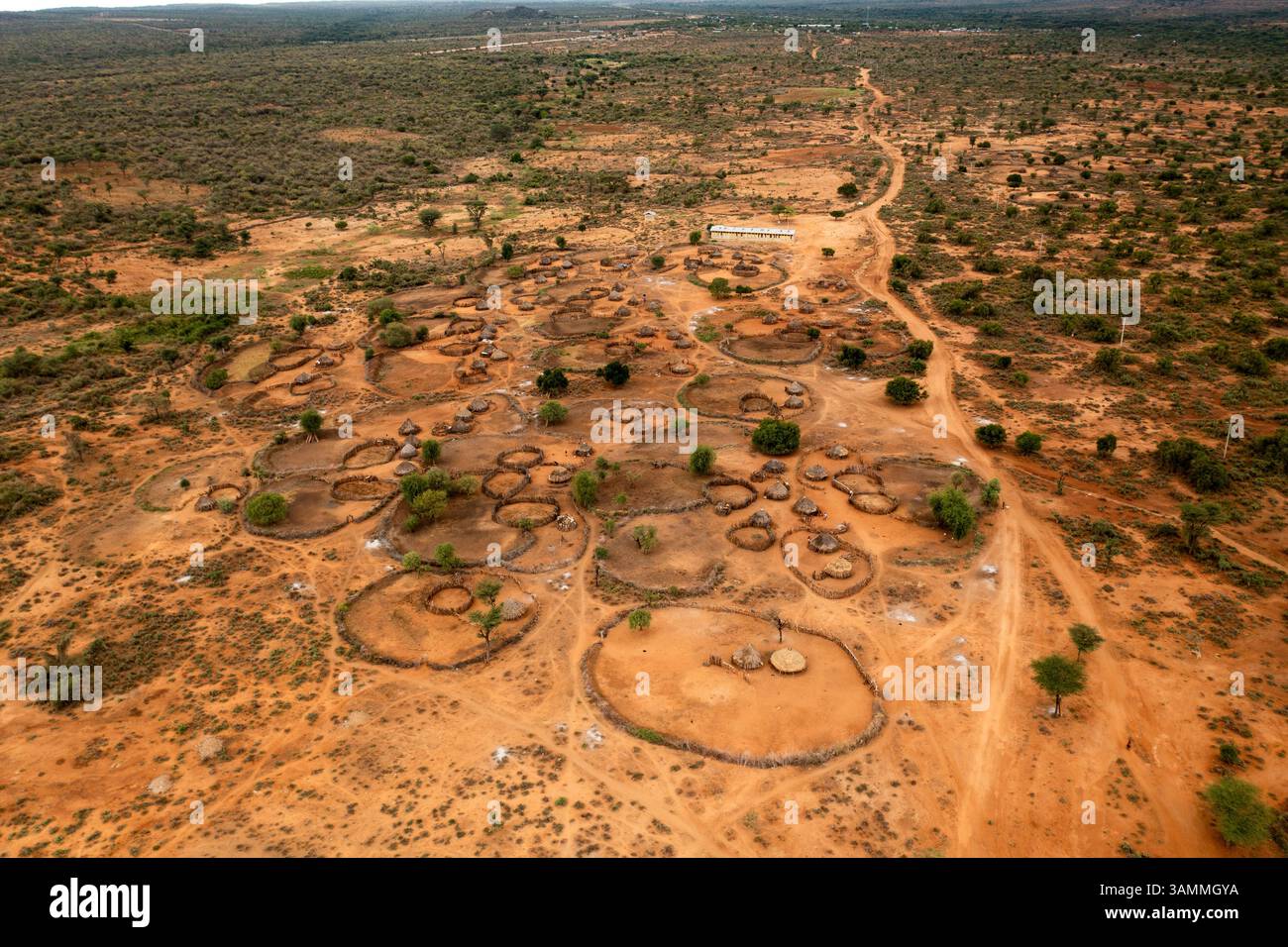 Aerial view of a traditional village in arid savanna landscape with ...
