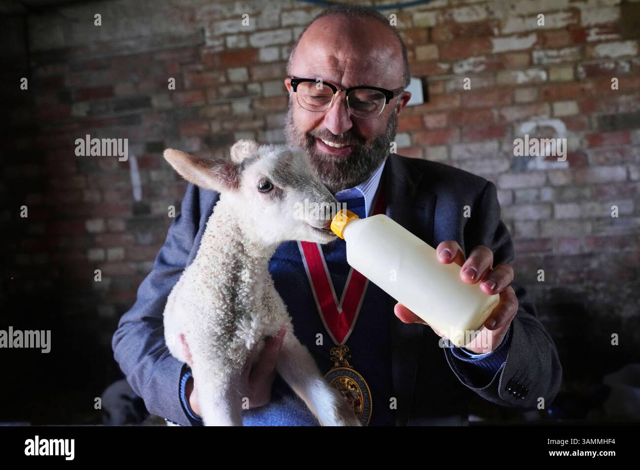 Manny Cohen the Master of the Worshipful Company of Woolmen feeds a ...