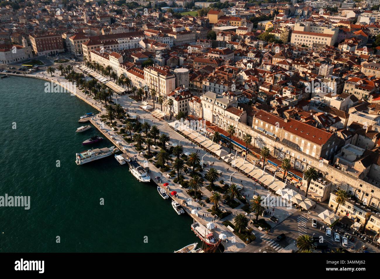 Aerial view of vibrant waterfront city with historic architecture and ...