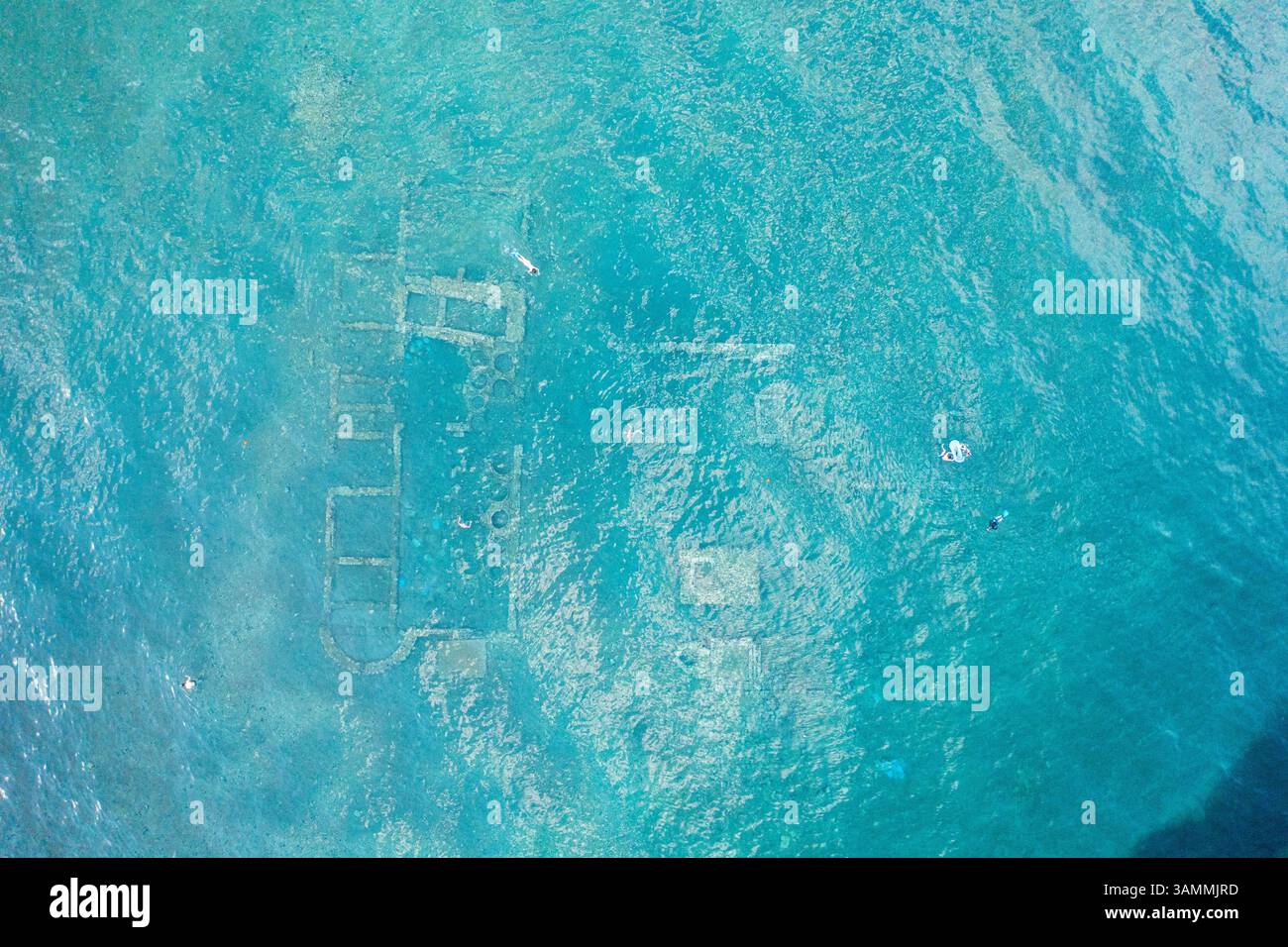 Aerial view of underwater ruins in turquoise water, Archea Epidavros ...