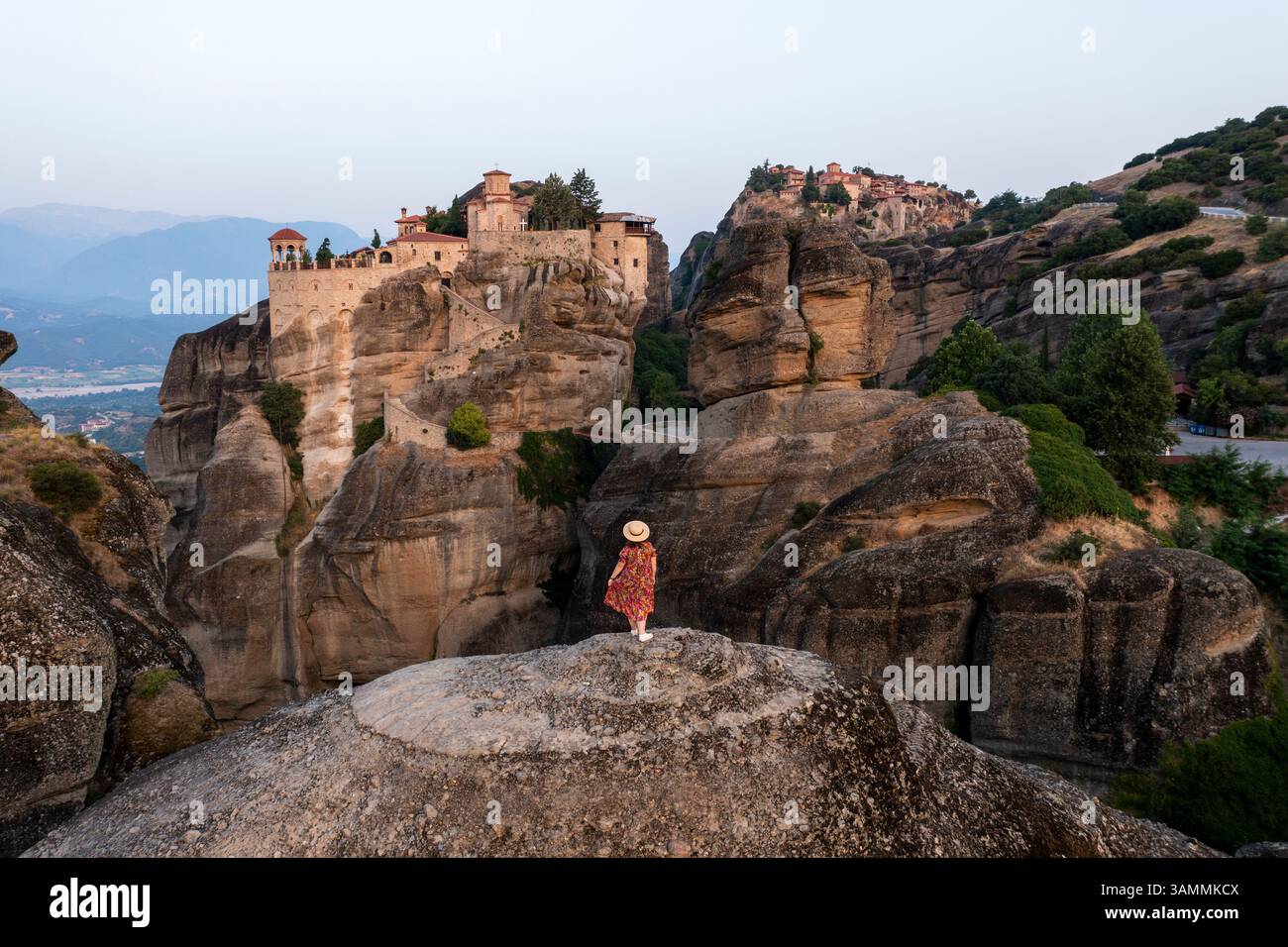 Aerial view of beautiful monasteries atop stunning rock formations in a ...