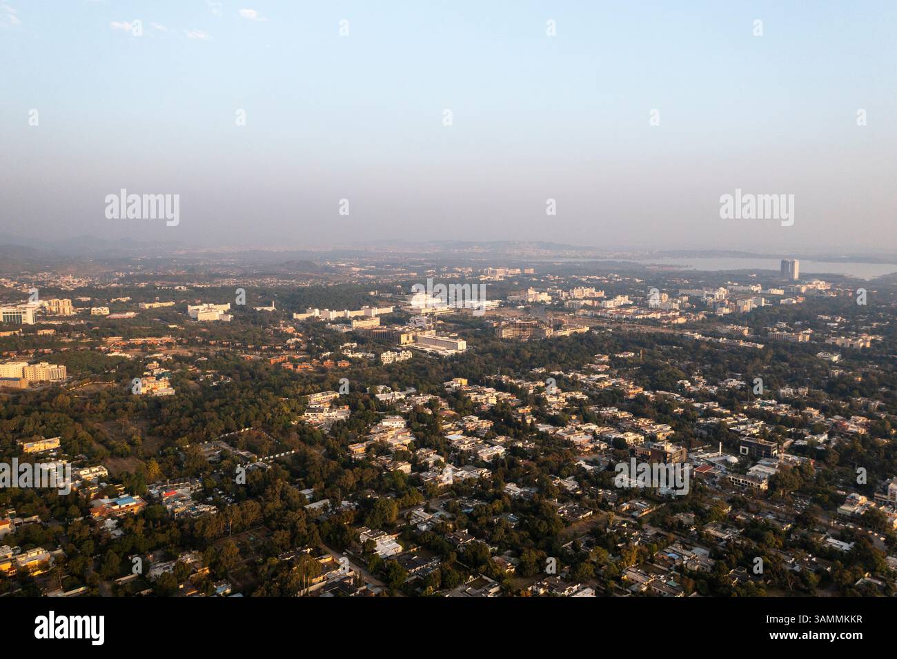 Aerial view of beautiful cityscape with modern buildings and lush ...
