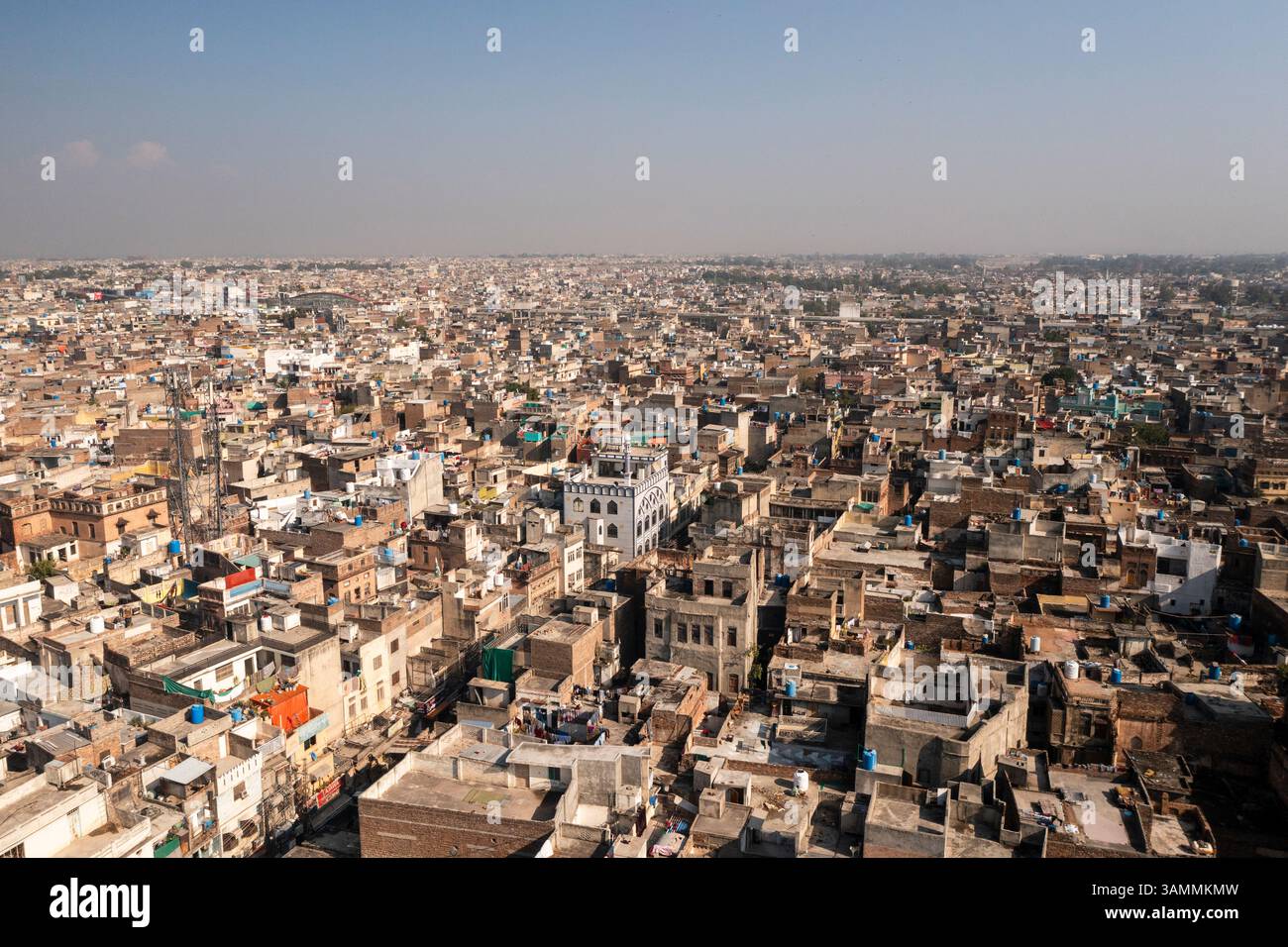 Aerial view of bustling cityscape with dense rooftops and vibrant ...