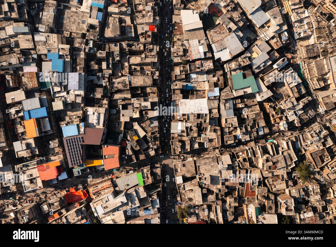Aerial view of dense urban landscape with crowded rooftops and streets ...
