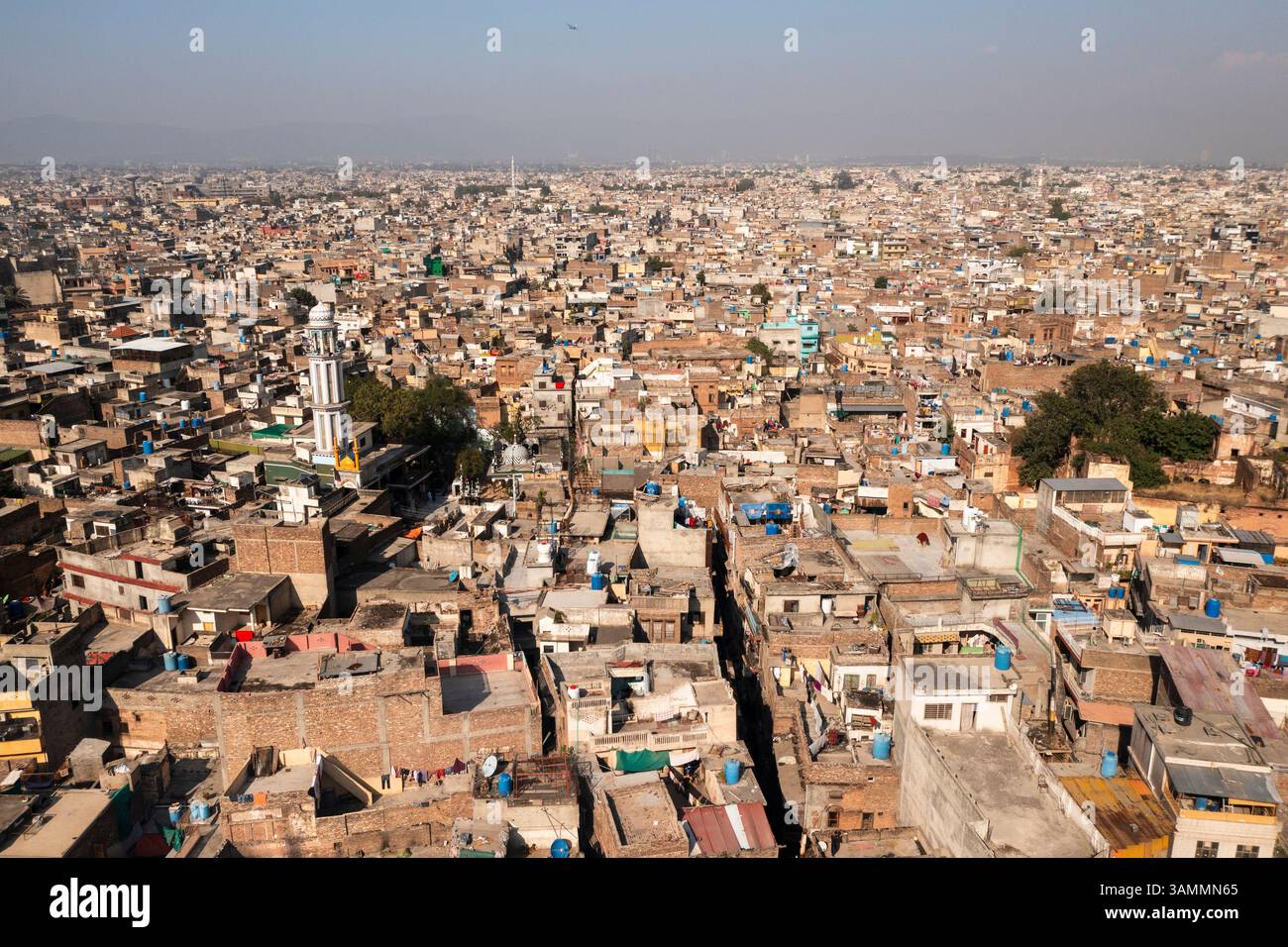 Aerial view of bustling urban landscape with densely populated rooftops and vibrant cityscape ...