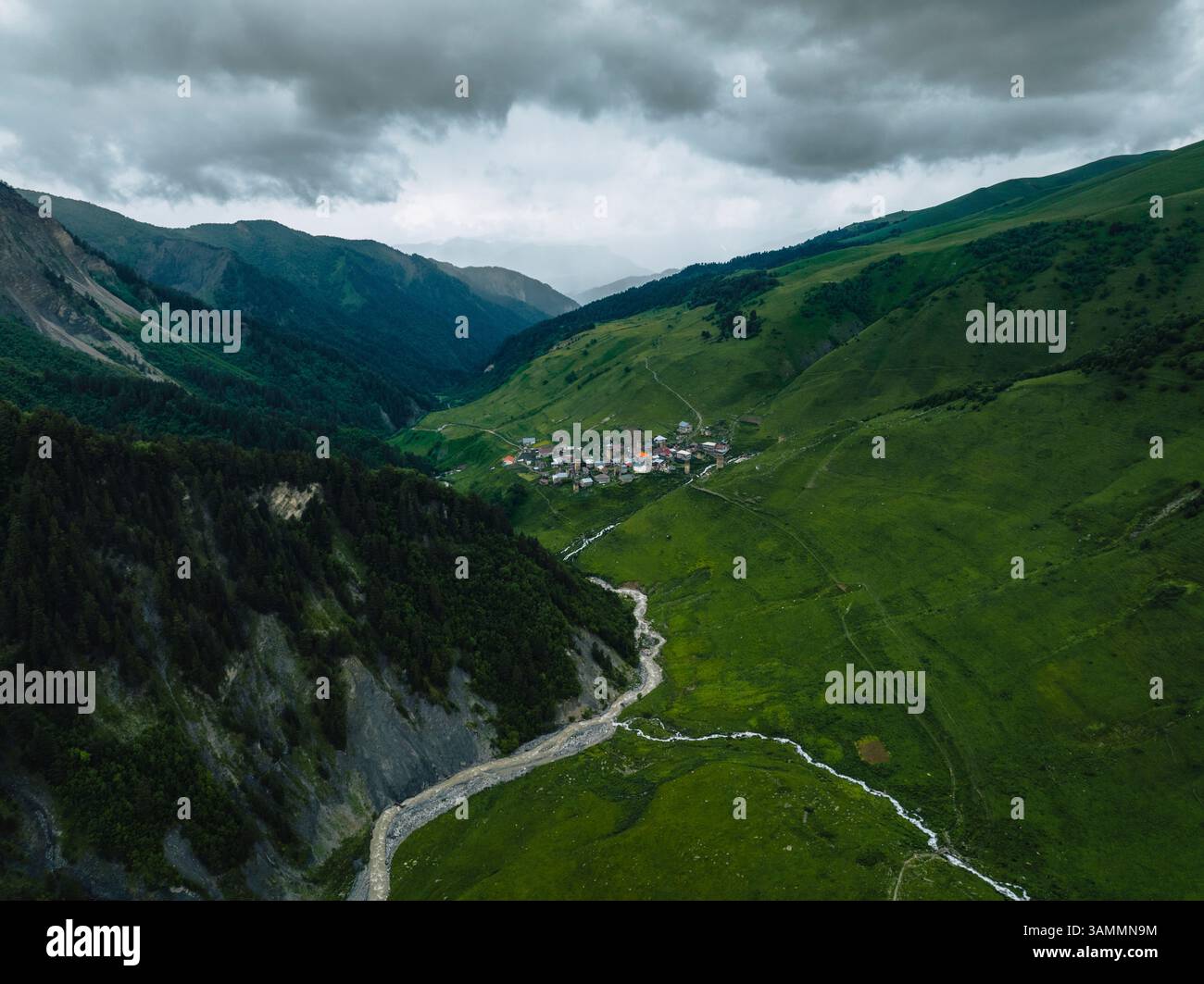 Aerial view of a picturesque village nestled in a lush valley with a ...