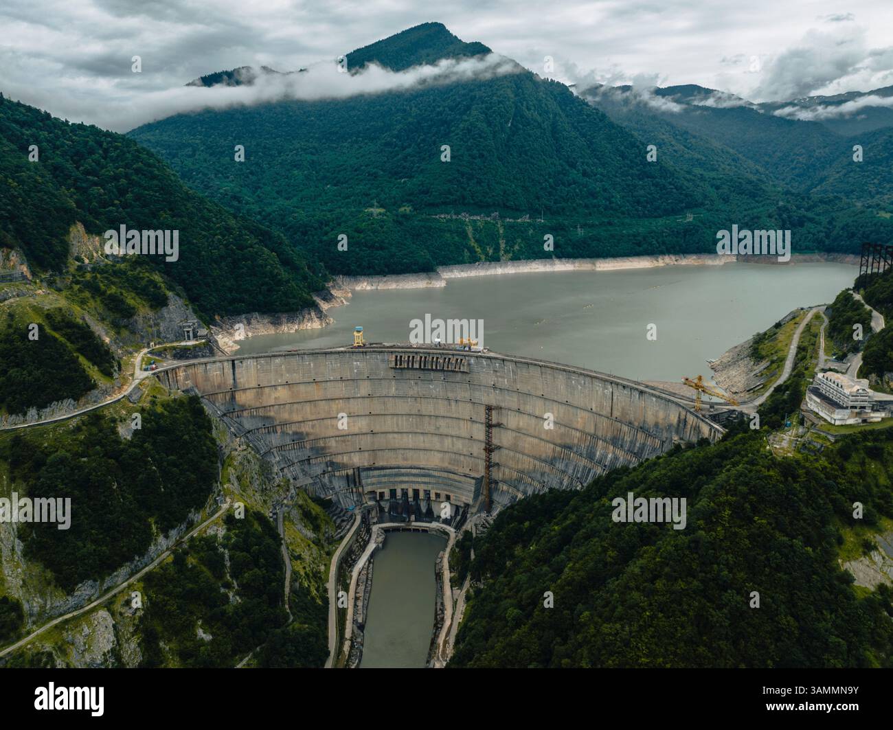 Aerial view of the majestic Enguri Dam surrounded by rugged mountains ...