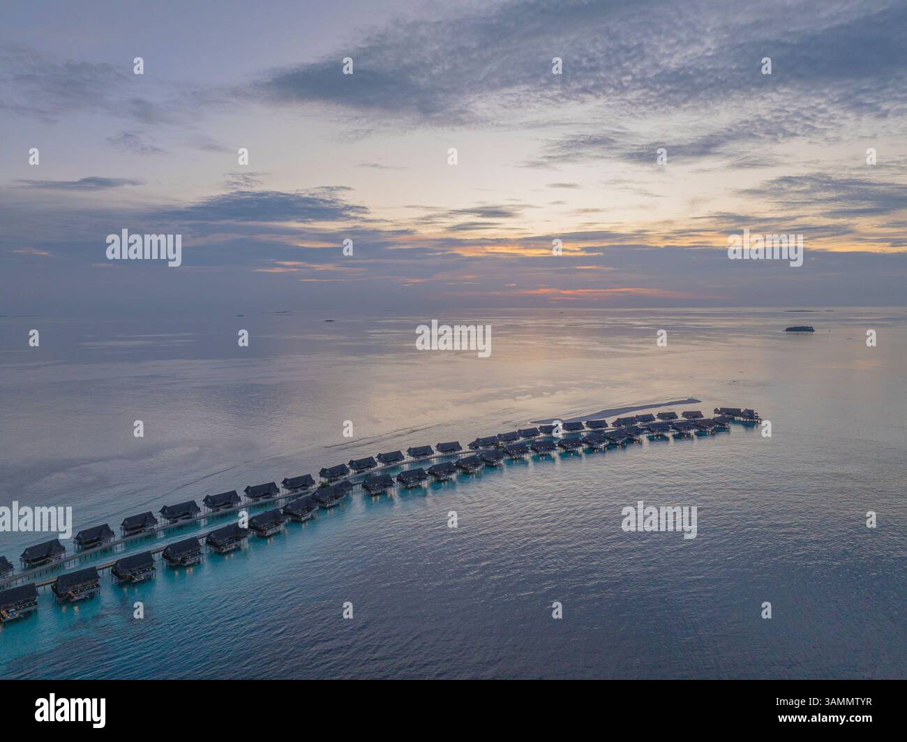 Aerial view of idyllic Muravandhoo Island resort with beautiful ...