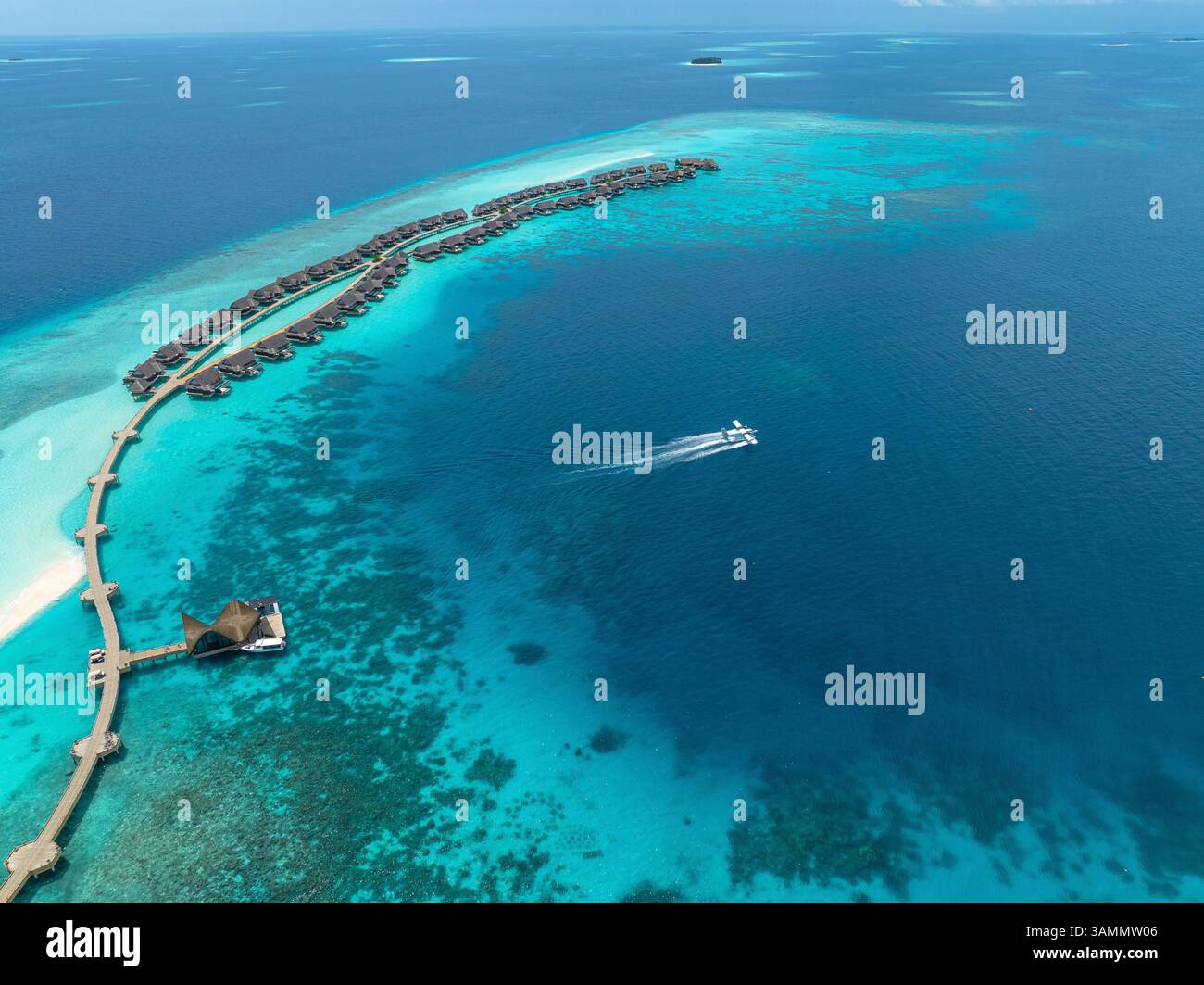 Aerial view of Muravandhoo Island with beautiful bungalows and ...