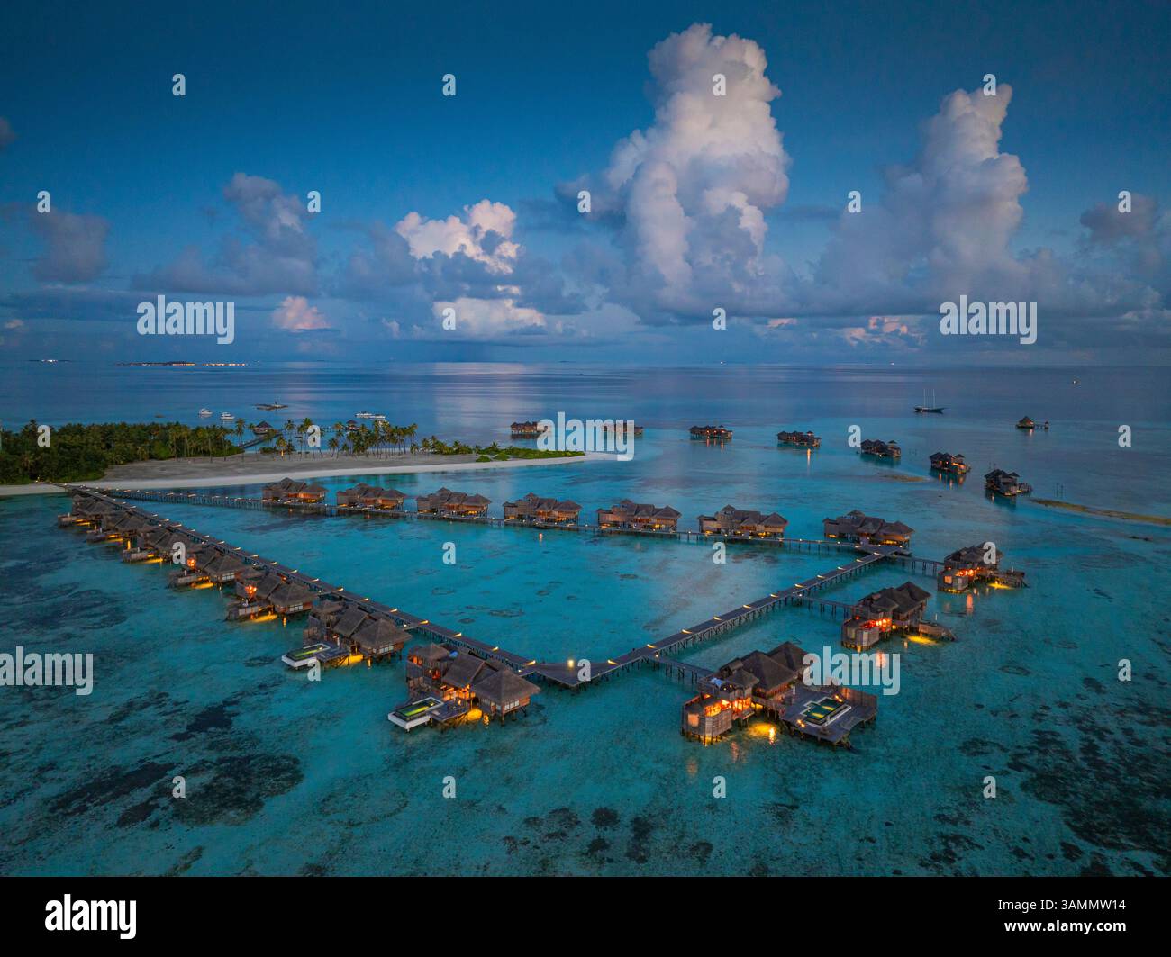 Aerial view of idyllic luxury resort bungalows on a tropical island ...