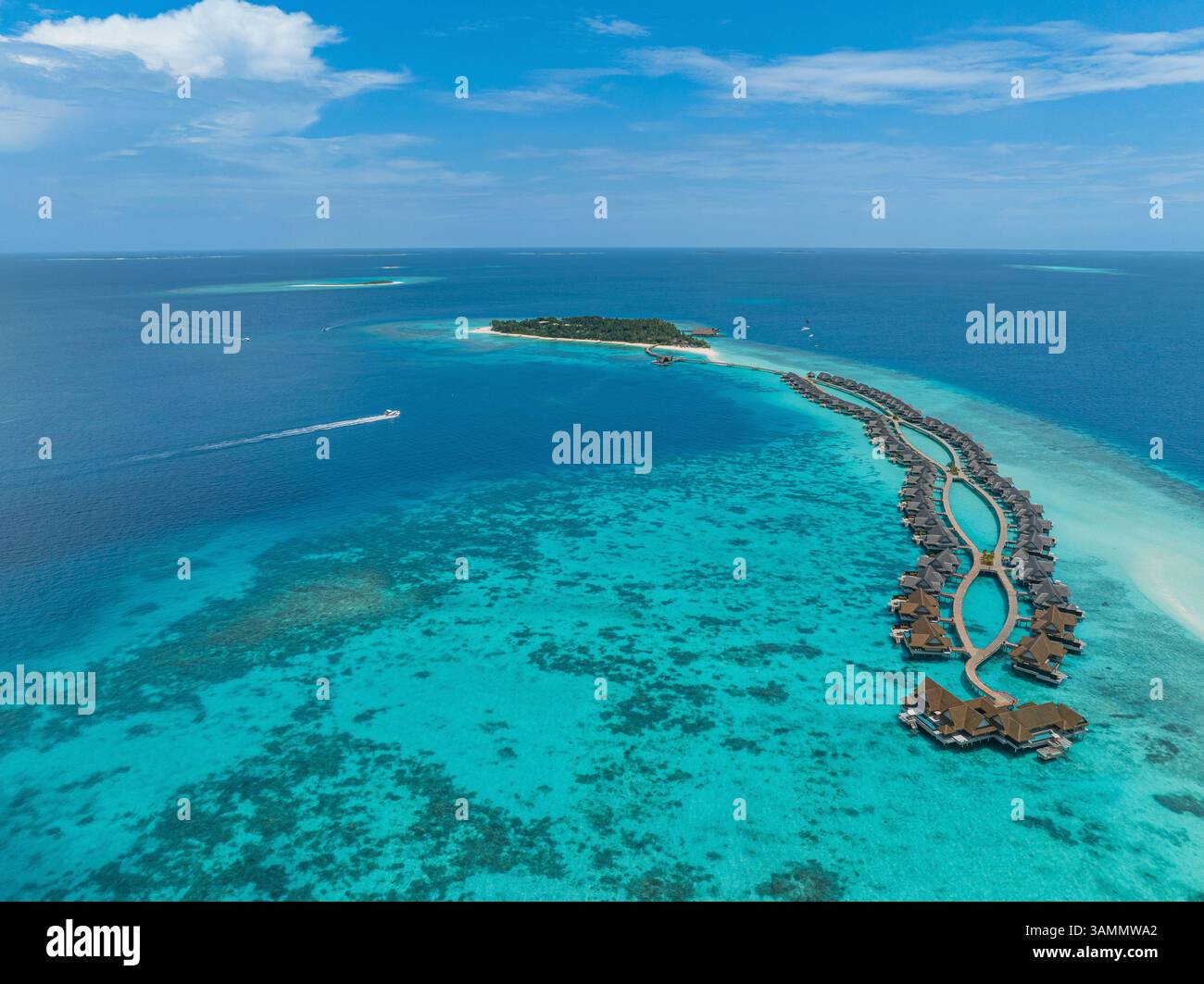 Aerial view of Muravandhoo Island with luxury overwater bungalows and ...