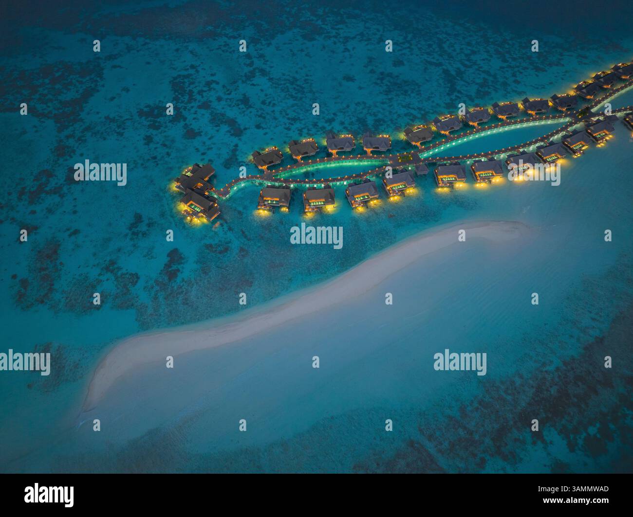 Aerial view of Muravandhoo Island with a luxurious resort and beautiful ...