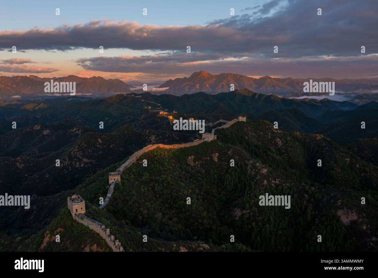 Aerial view of jinshanling great wall amidst majestic mountains under a ...