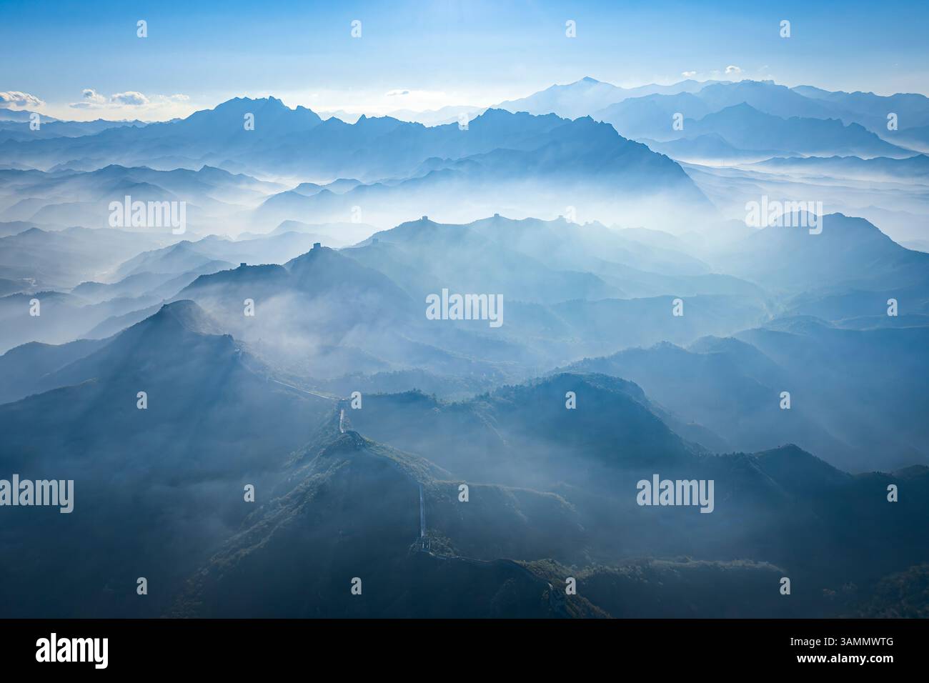 Aerial view of the majestic Jinshanling Great Wall amidst serene misty ...