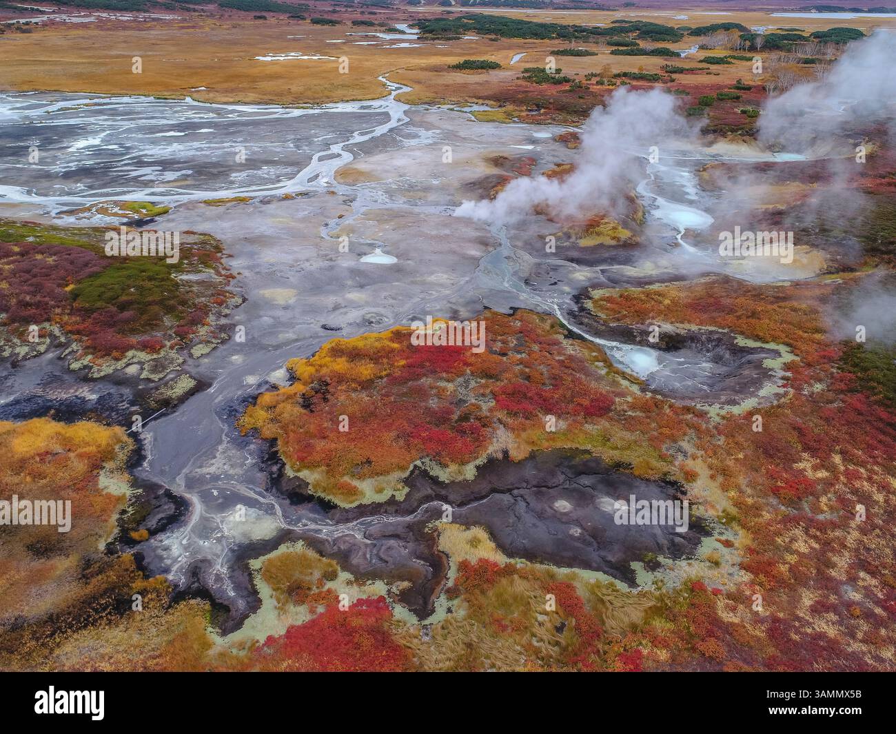 Aerial view of colorful geothermal caldera with steam and unique ...