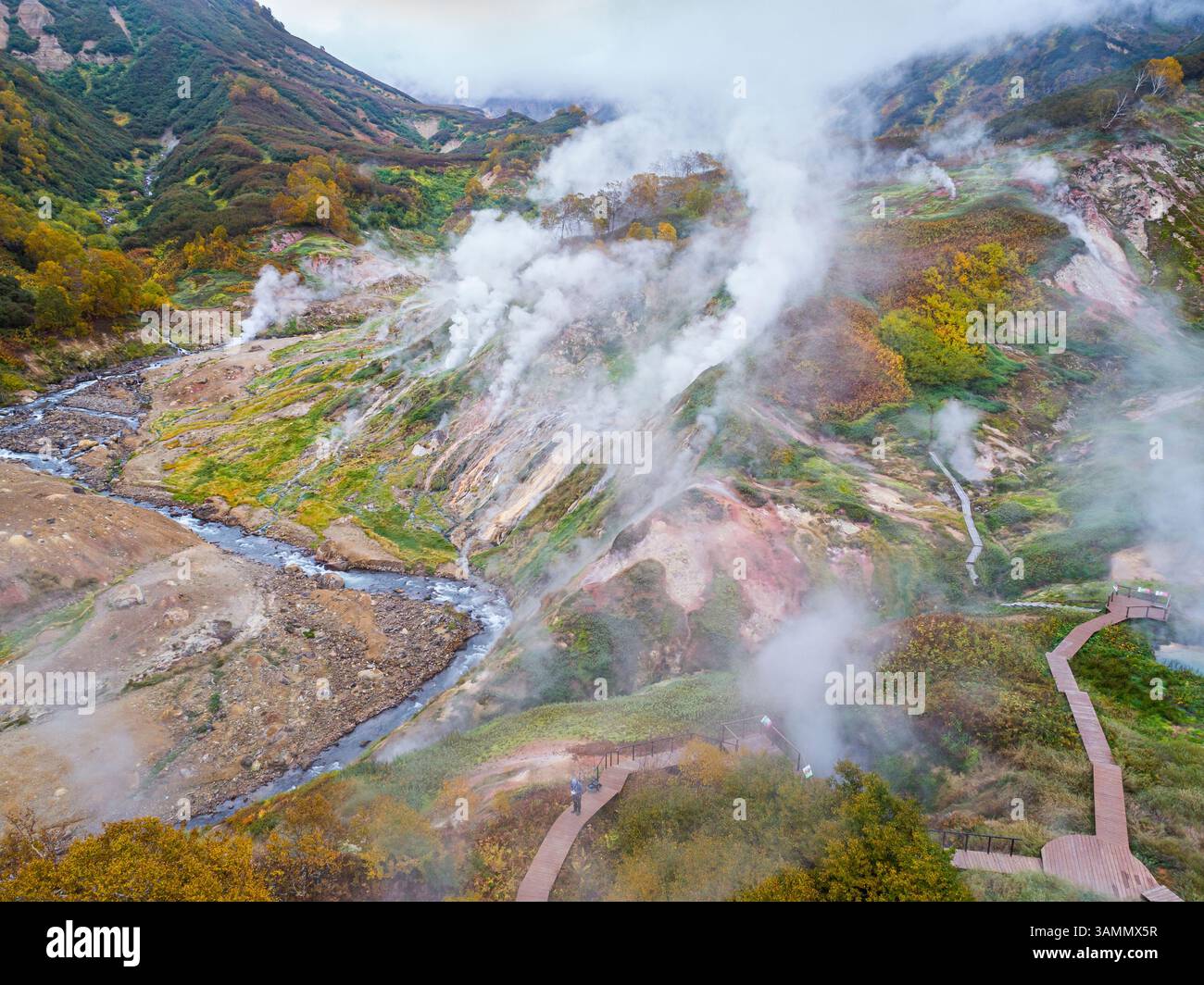 Aerial view of the breathtaking valley of geysers with steaming ...