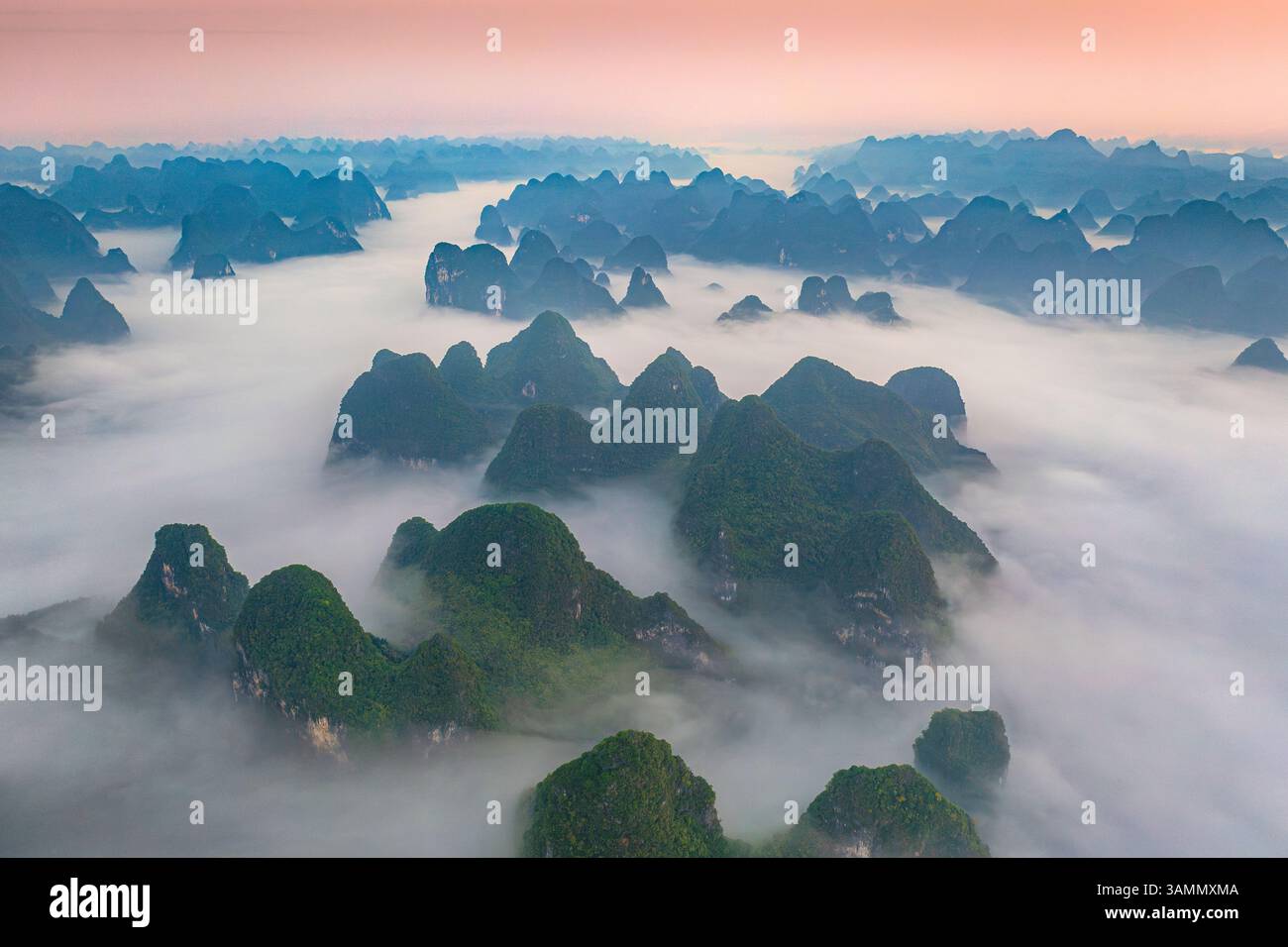 Aerial view of guilin mountains shrouded in mist and clouds, yangshuo ...