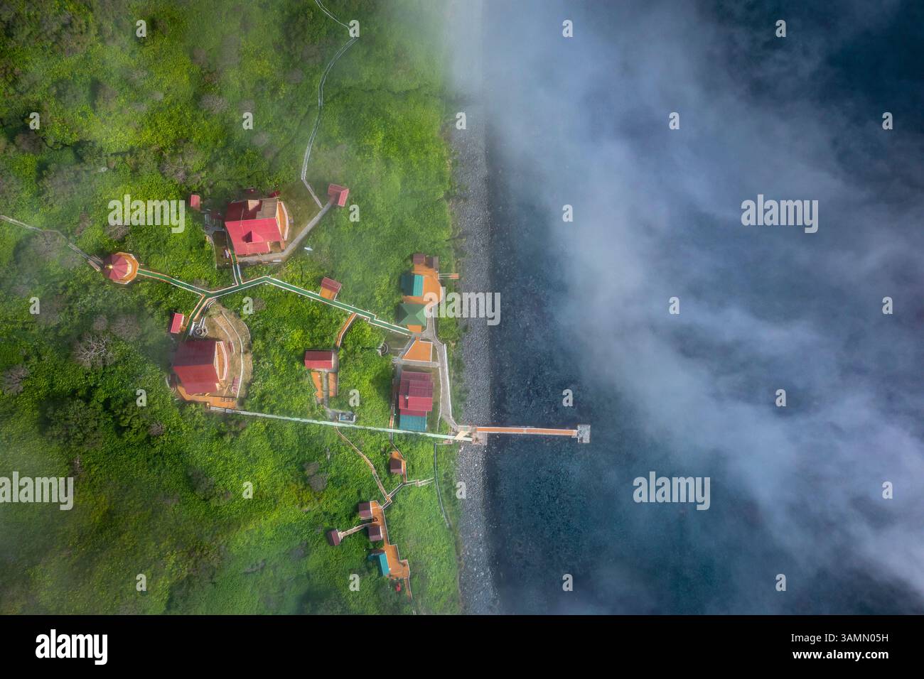 Aerial panoramic view of houses and small village on Ostrov Moneron ...