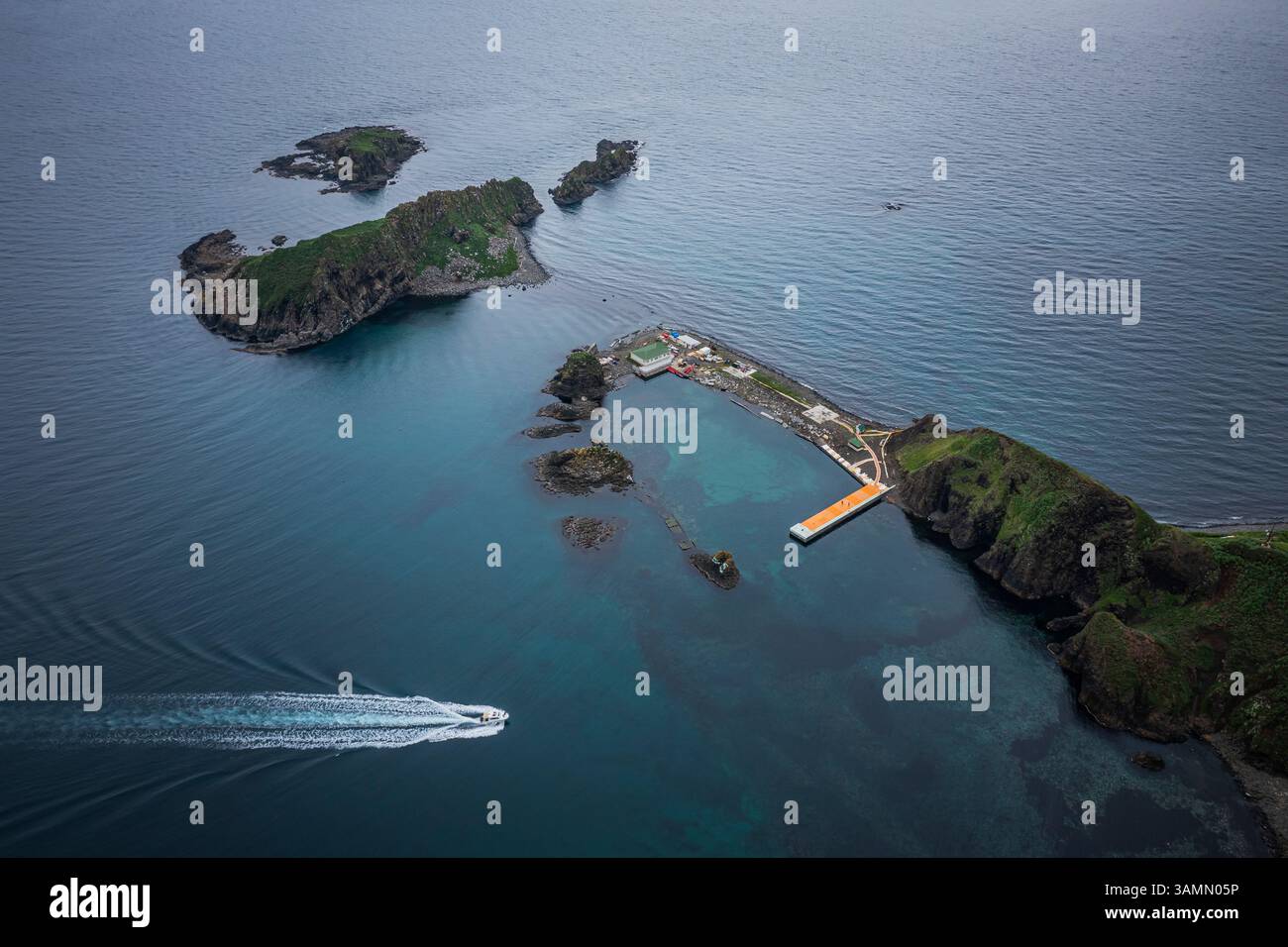 Aerial view of a boat sailing along Ostrov Moneron island, Nevelsk ...