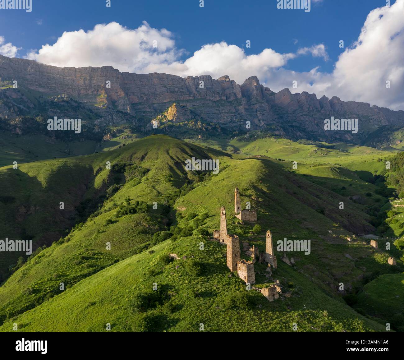 Aerial view of castle ruins on the mountains green slope, Karachay ...