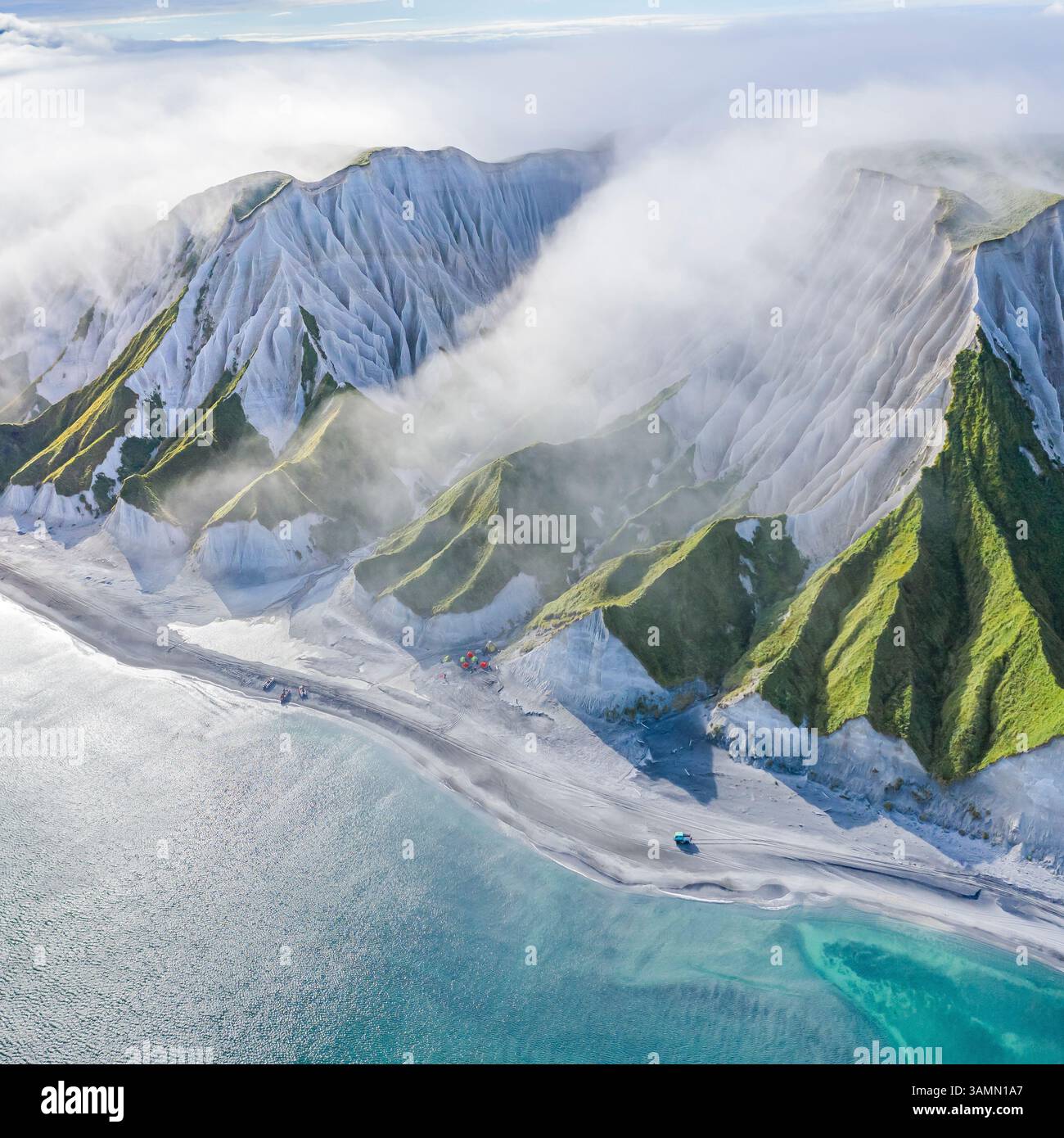 Aerial panoramic view of Iturup Island along Sea of Okhotsk coastline ...
