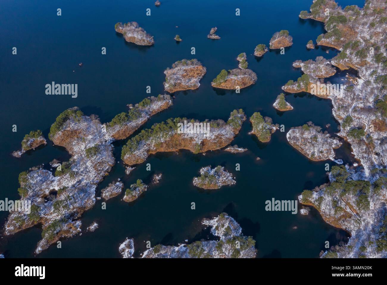 Aerial view of Lake Hibara at sunset, a geothermal and volcanic lake in ...