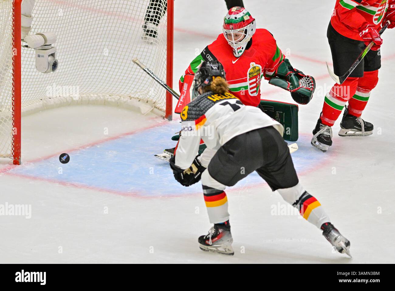 L-R Luisa Welcke (GER) and goalkeeper Aniko Nemeth (HUN) in action ...