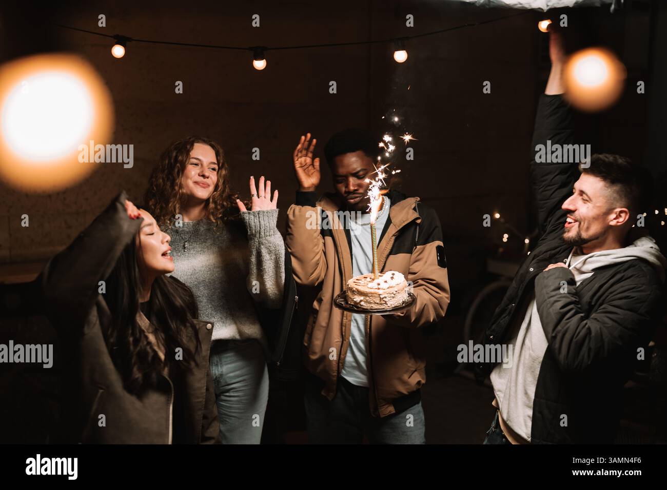 Celebration friends joyfully raise hi-res stock photography and images ...