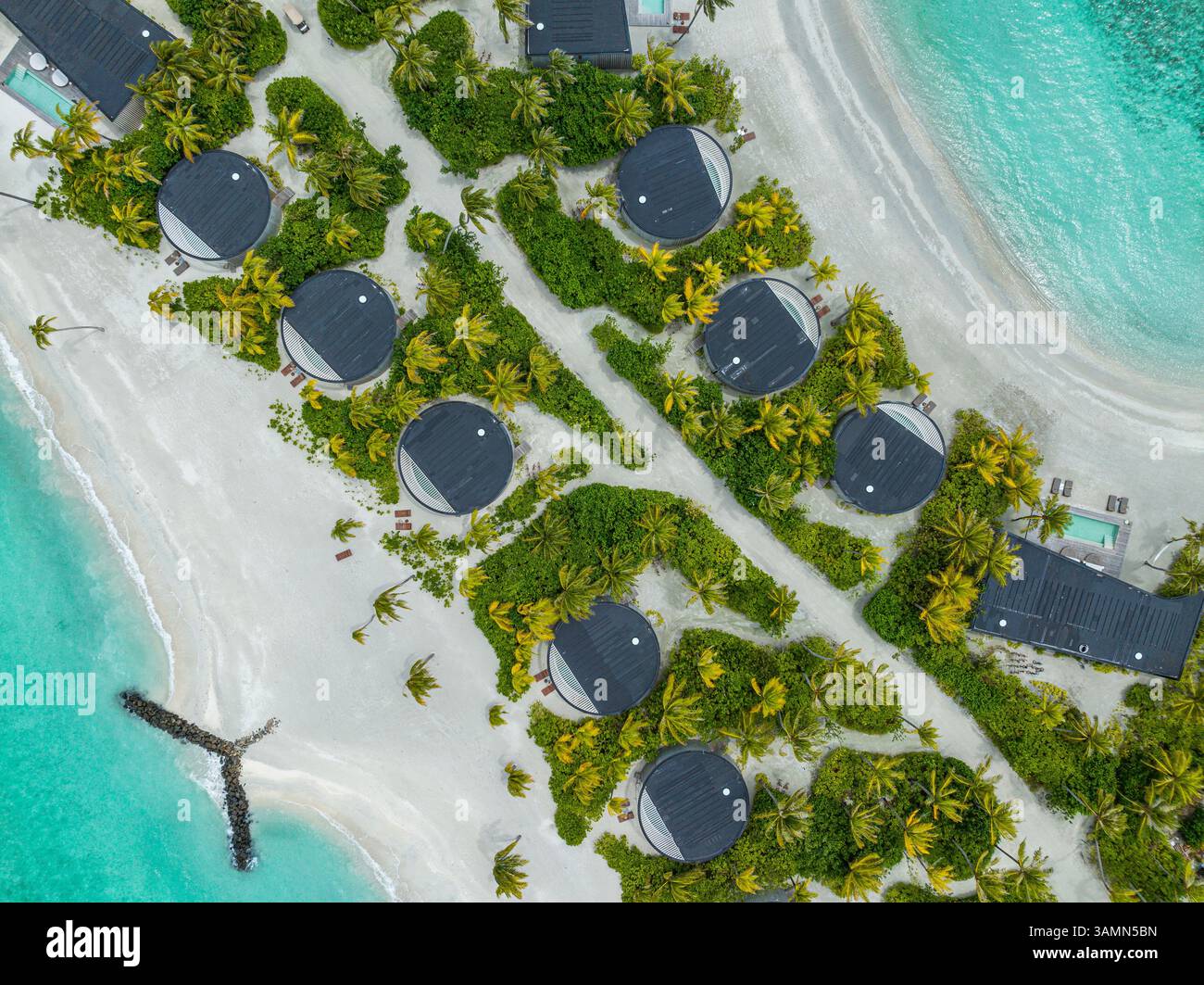 Aerial view of a luxury resort bungalows on Fari Island, Maldives ...