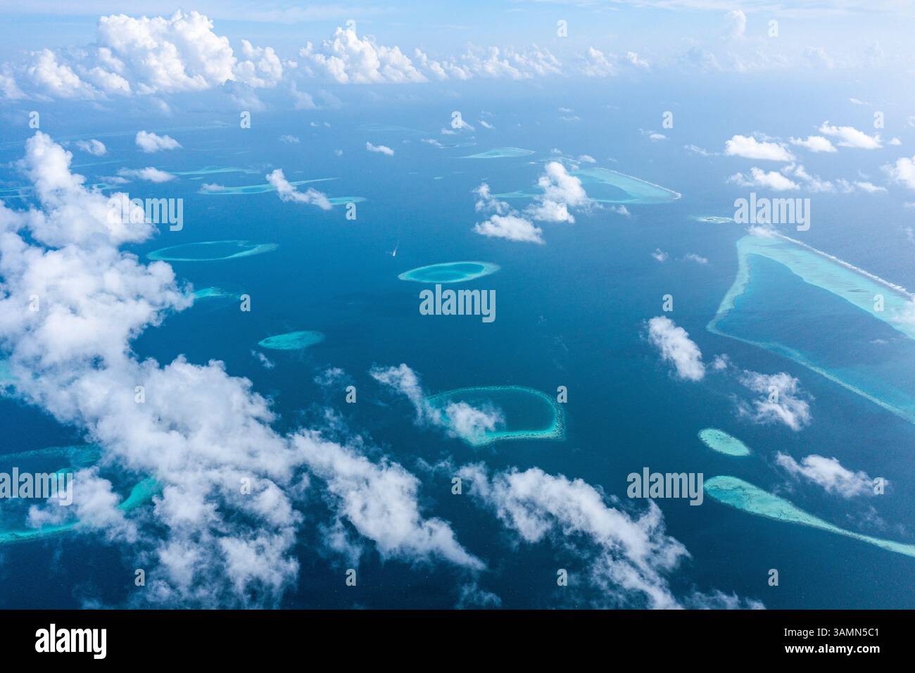 Aerial view of Ithaafushi Island and Atolls with low clouds, Maldives ...