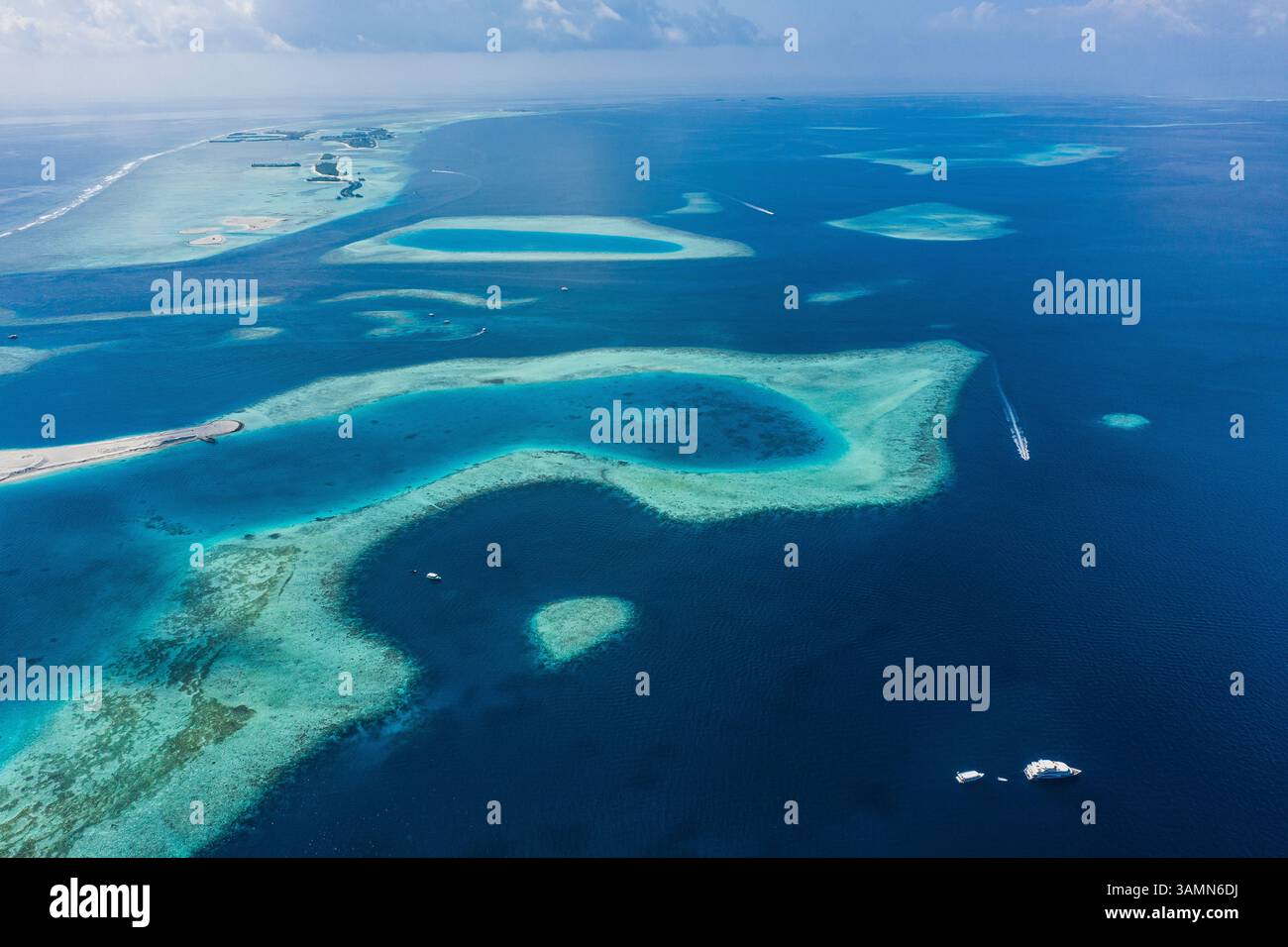 Aerial view of beautiful Atolls with barrier Reef surrounded by the ...
