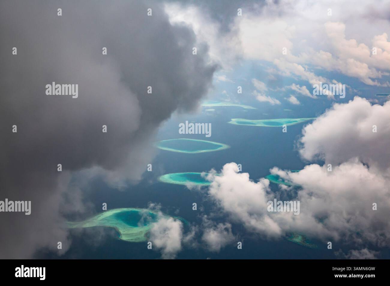Aerial view of Atolls in Maldives archipelagos in the Indian Ocean with ...