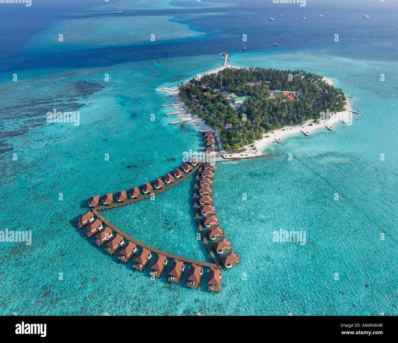Aerial view of a luxury resort with bungalow on Alimatha Island ...